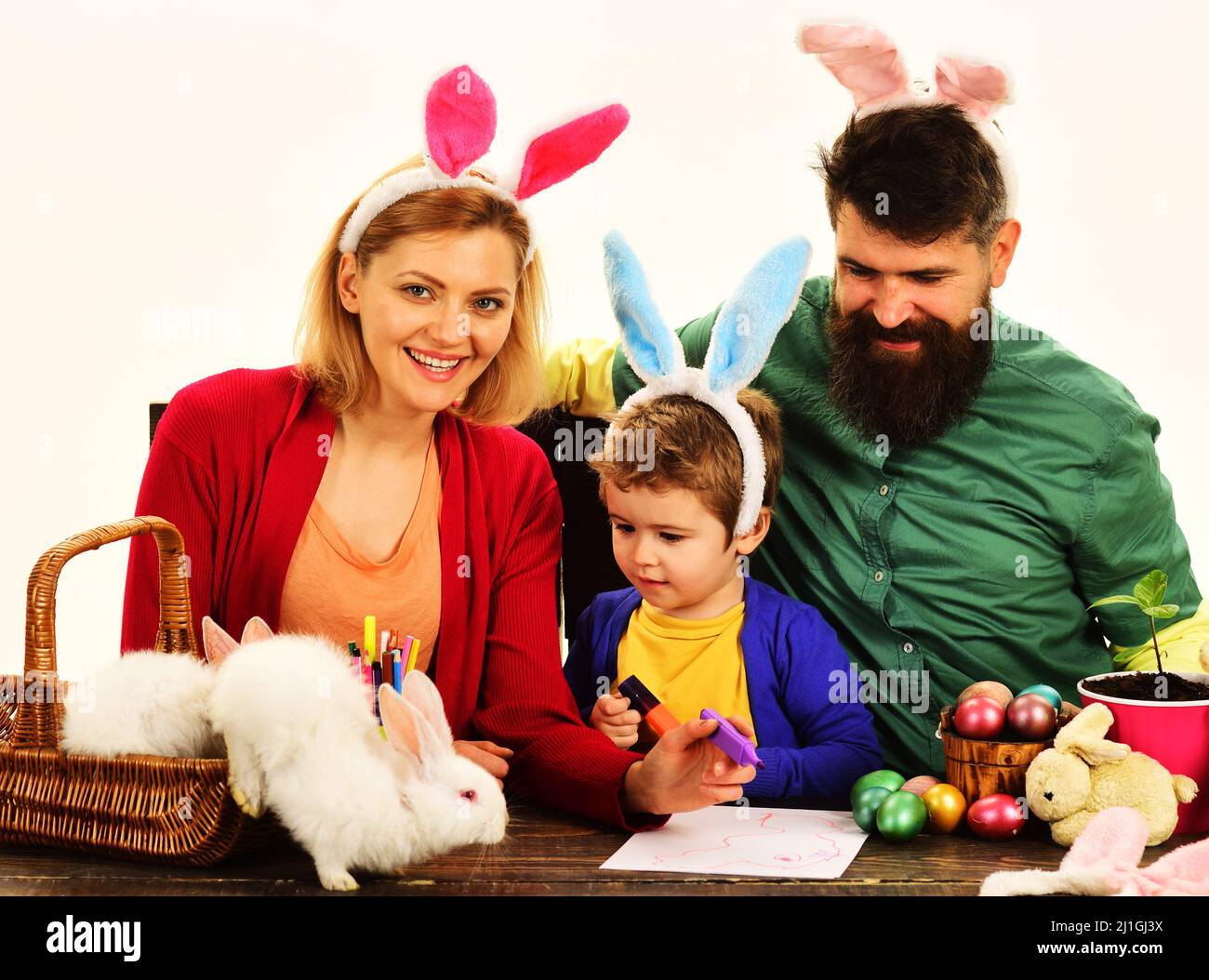 Happy family with son preparing for Easter celebration. Mother, father ...