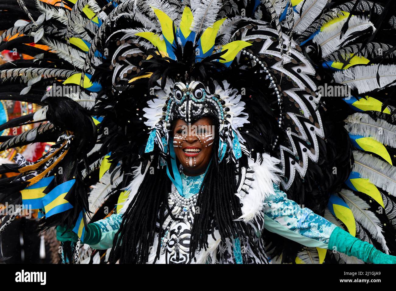A Bahamian Junkanoo performer celebrates and parades during a ...