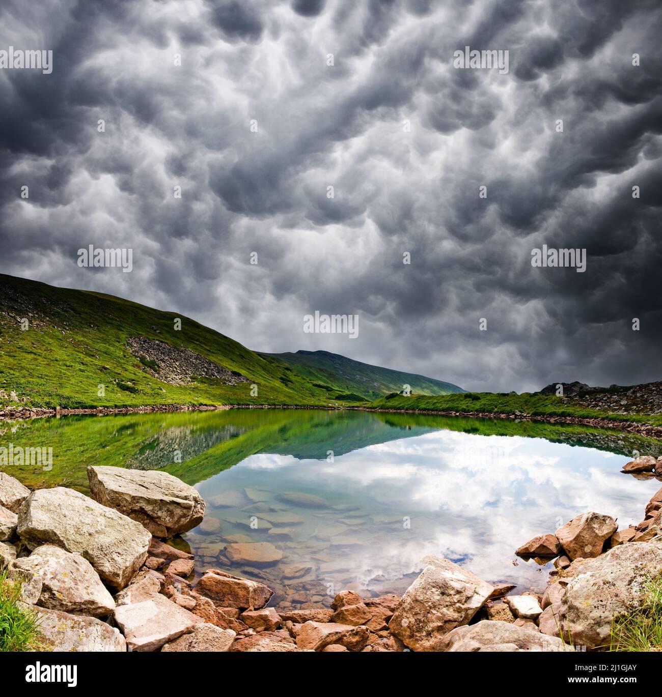 Beautiful mountains landscape over a calm lake Stock Photo - Alamy