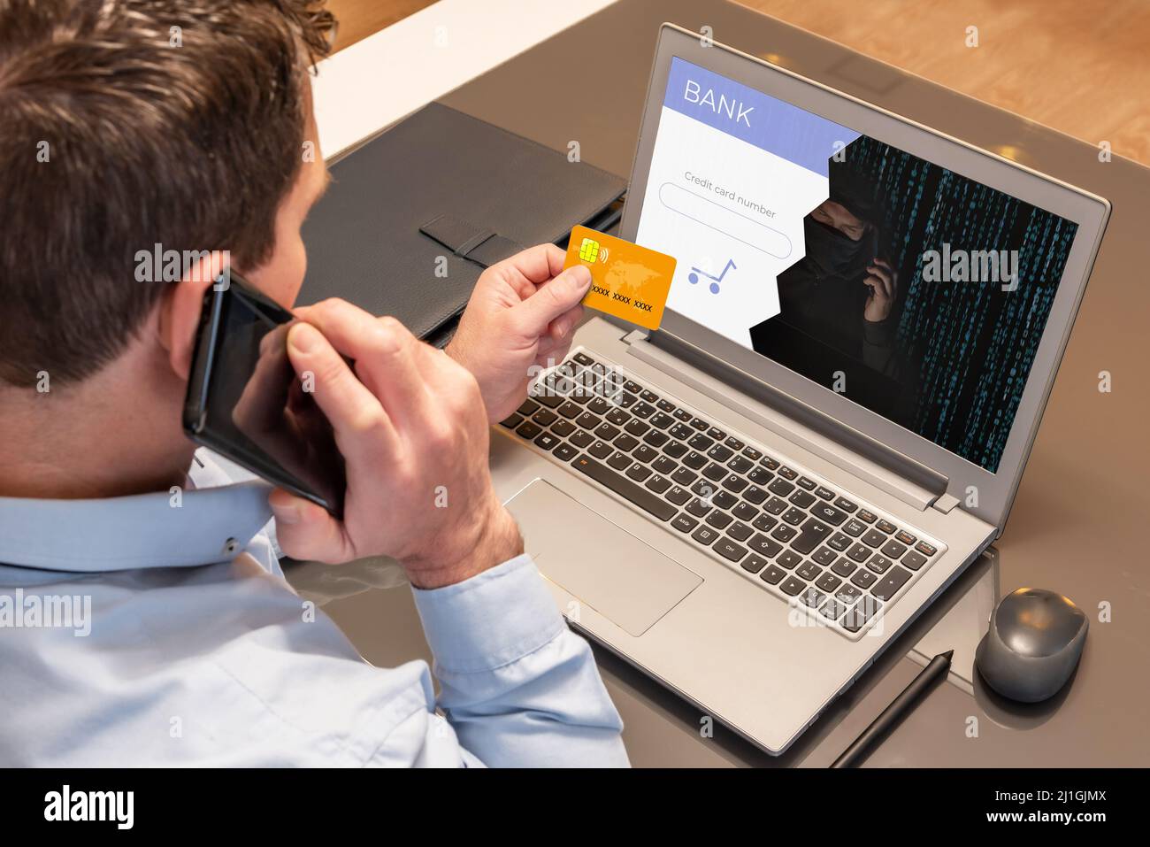 Man making purchases with his credit card over the phone while being ...