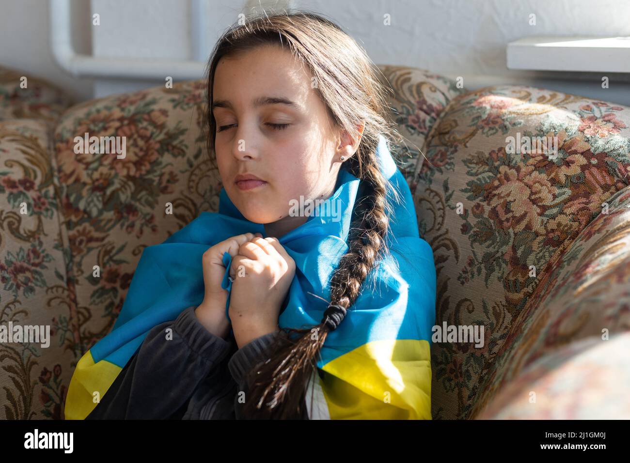 Pray for Ukraine. Child with Ukrainian flag. Little girl waving ...