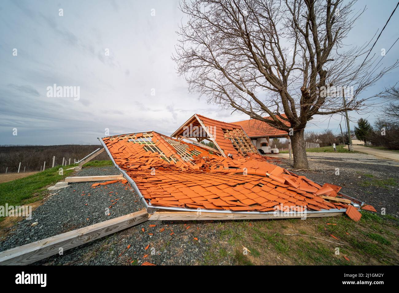 Broken roof after a storm Stock Photo - Alamy