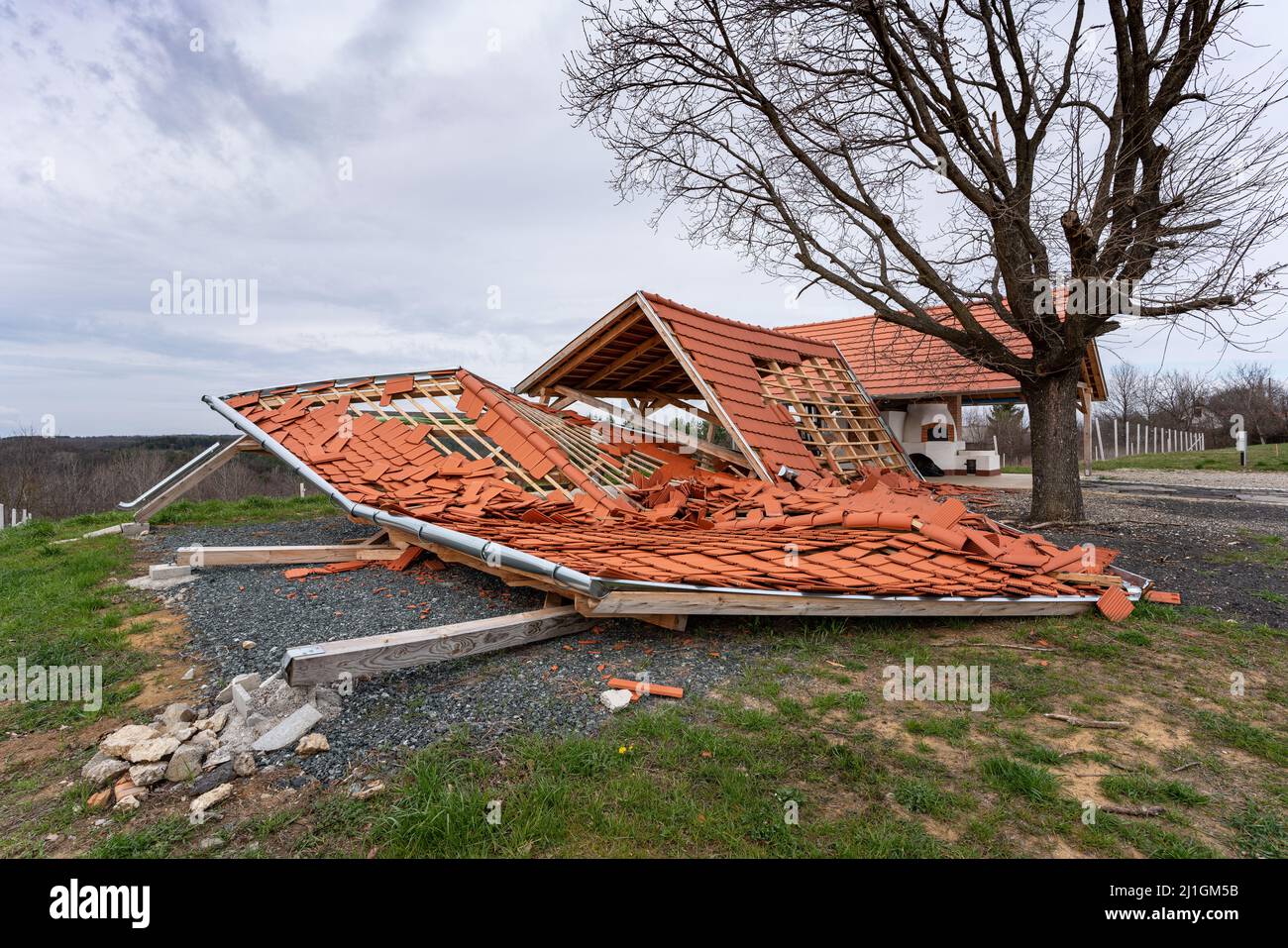 Broken roof after a storm Stock Photo - Alamy