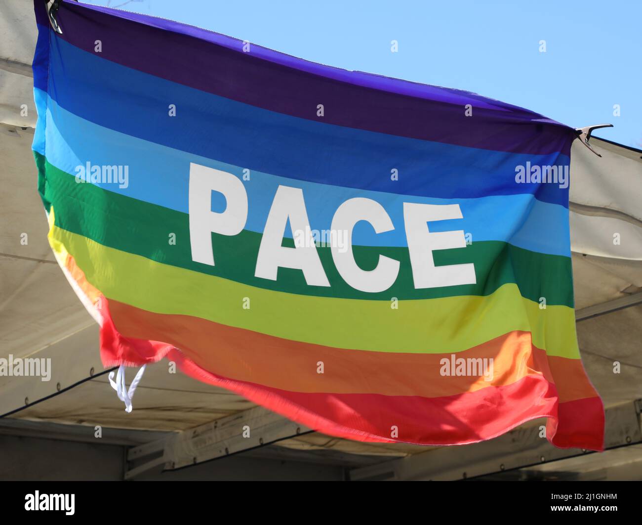 multicolored flag with the big Italian word PACE which means peace and ...