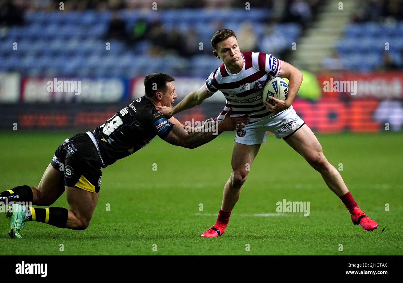 Wigan Warriors Jai Field (right) gets past Salford Red Devils Deon ... Wigan Warriors Jai Field (right) gets past Salford Red Devils Deon ...