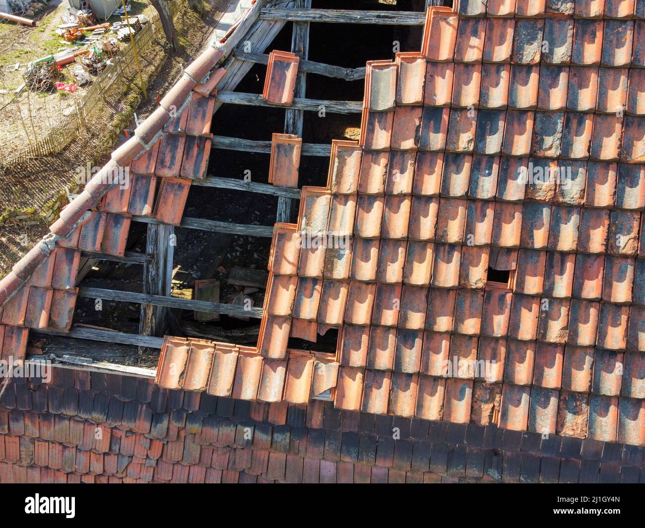 Broken tile roof after hi-res stock photography and images - Alamy