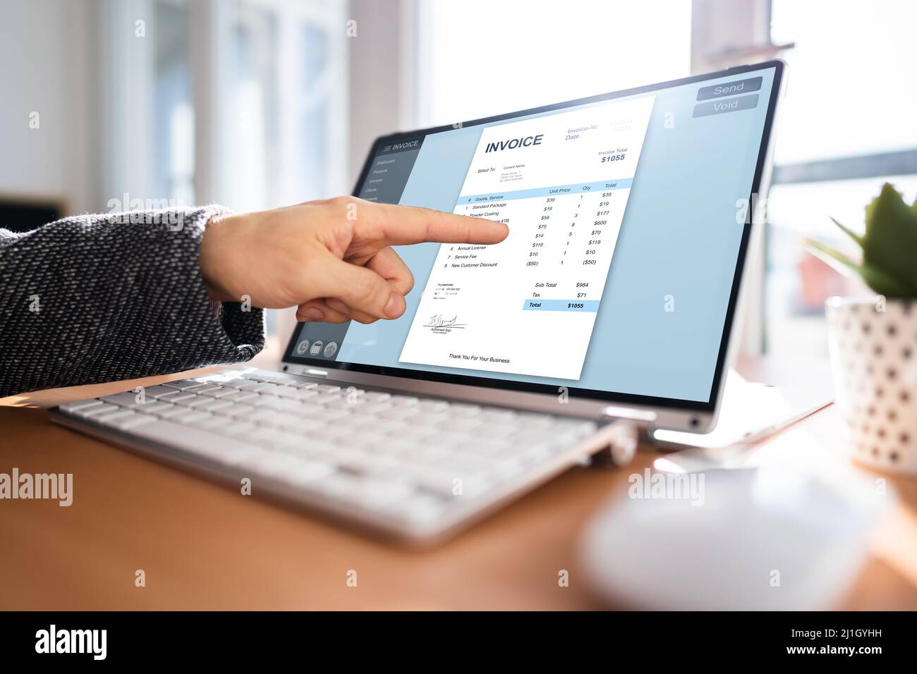 Young Businessman Using Laptop With Computer Screen Showing Invoice ...