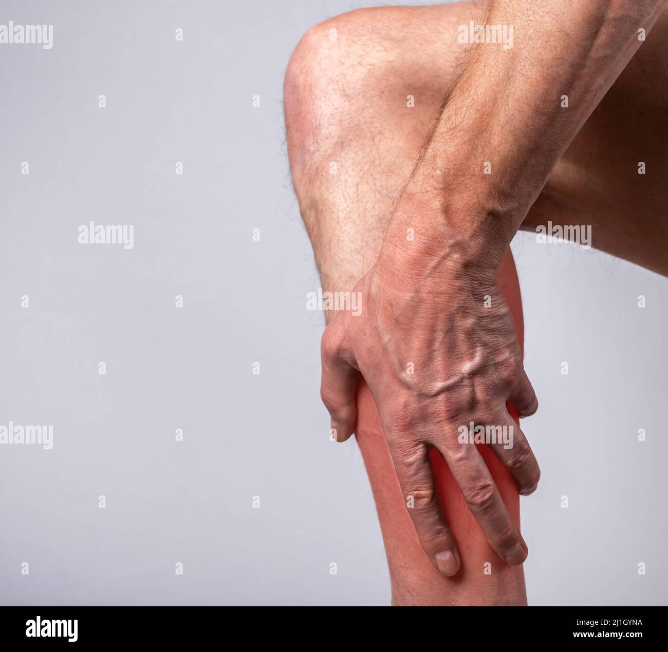 Calf muscle pain. Man hand holding leg with red point closeup. Joint ... Calf muscle pain. Man hand holding leg with red point closeup. Joint ...