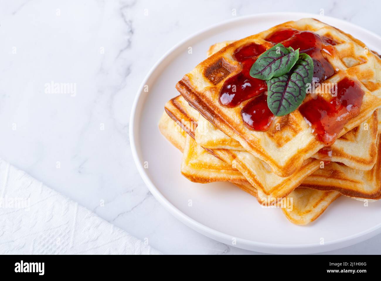 Homemade delicious belgian waffles on the white table Stock Photo - Alamy