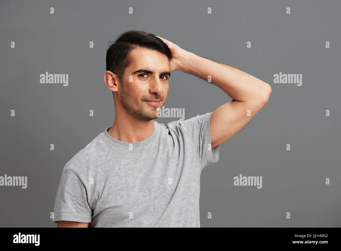portrait man posing lifestyle gesture with hands Gray background Stock ...
