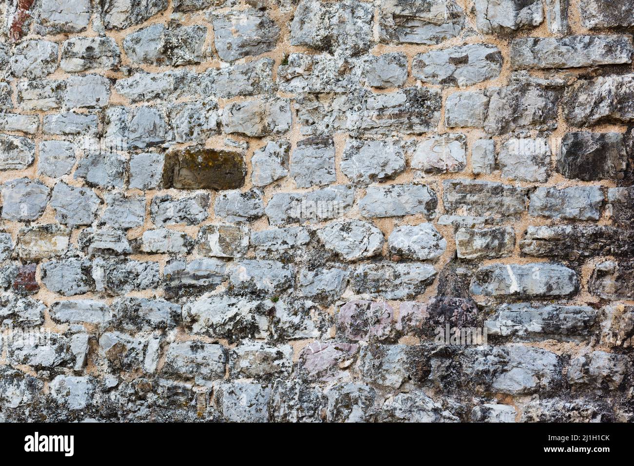 Empty gray stone wall covered with cracks of old house. Urban ...