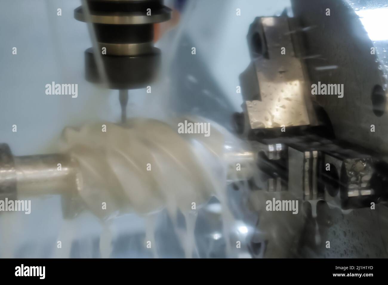 Turning milling machine with cooling system cutting metal workpiece at ...