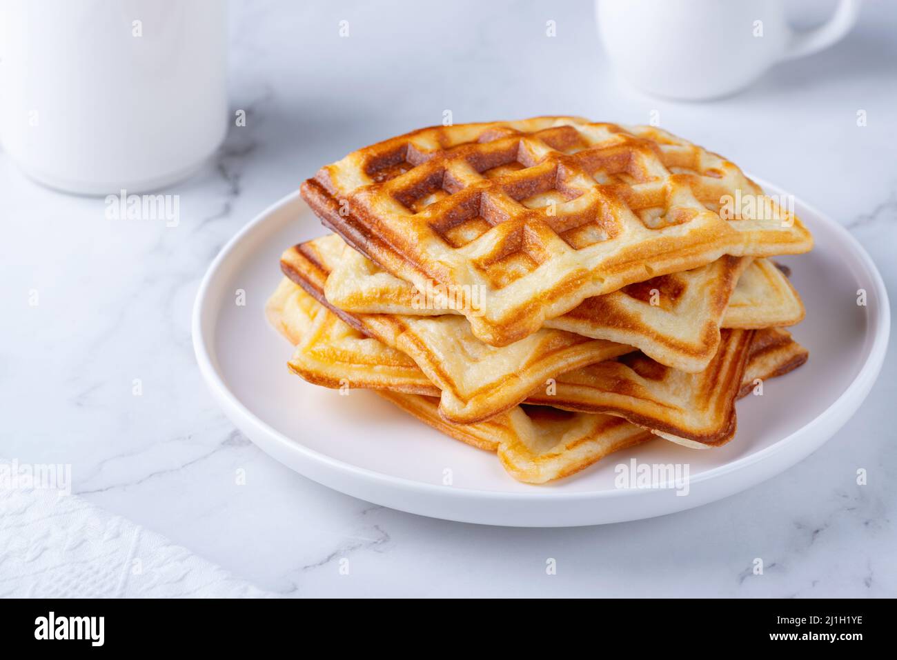 Homemade delicious belgian waffles on the white table Stock Photo - Alamy