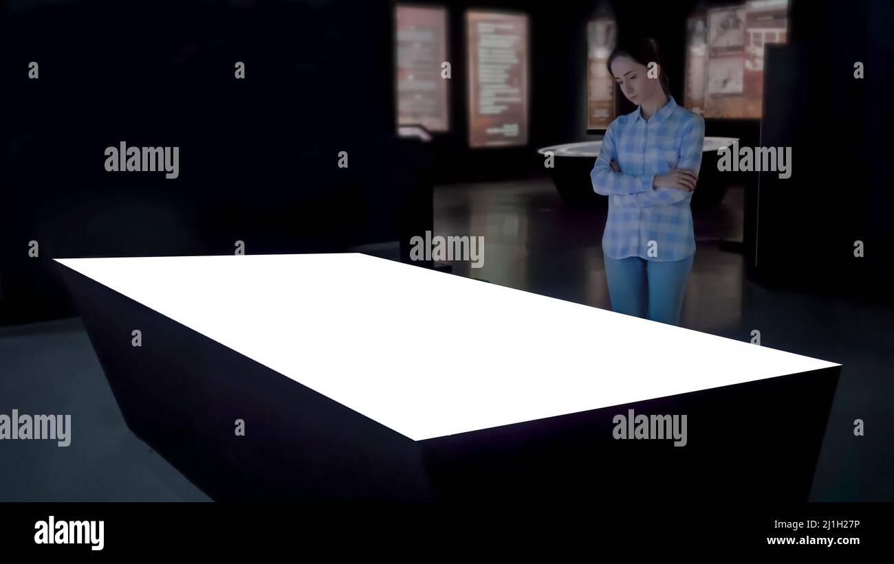 White screen concept - woman looking at blank white display of table ...