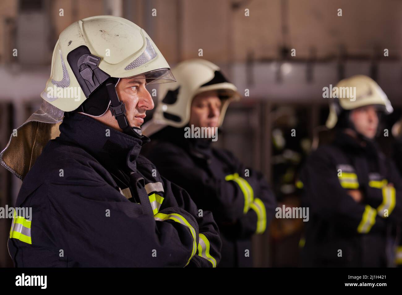 Group of professional firefighters standing together. Firefighters ...