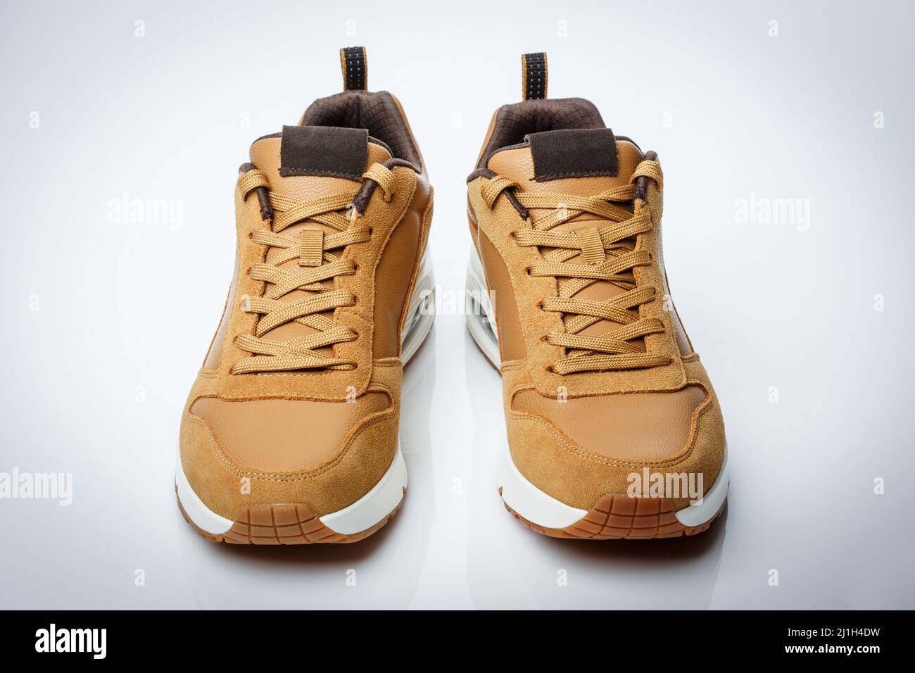 New yellow foxy leather and suede casual sport male sneakers on a white ...