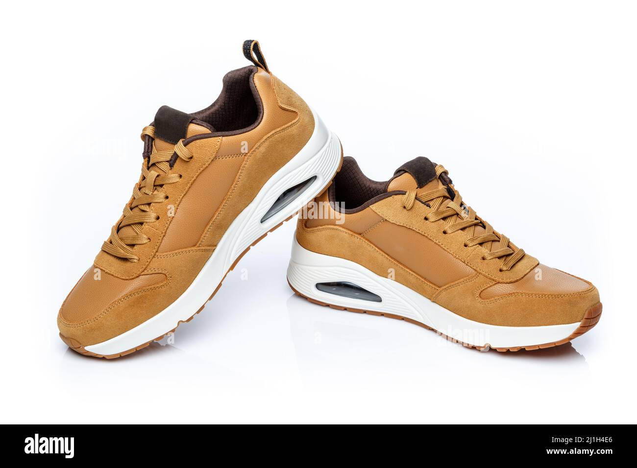 New yellow foxy leather and suede casual sport male sneakers on a white ...