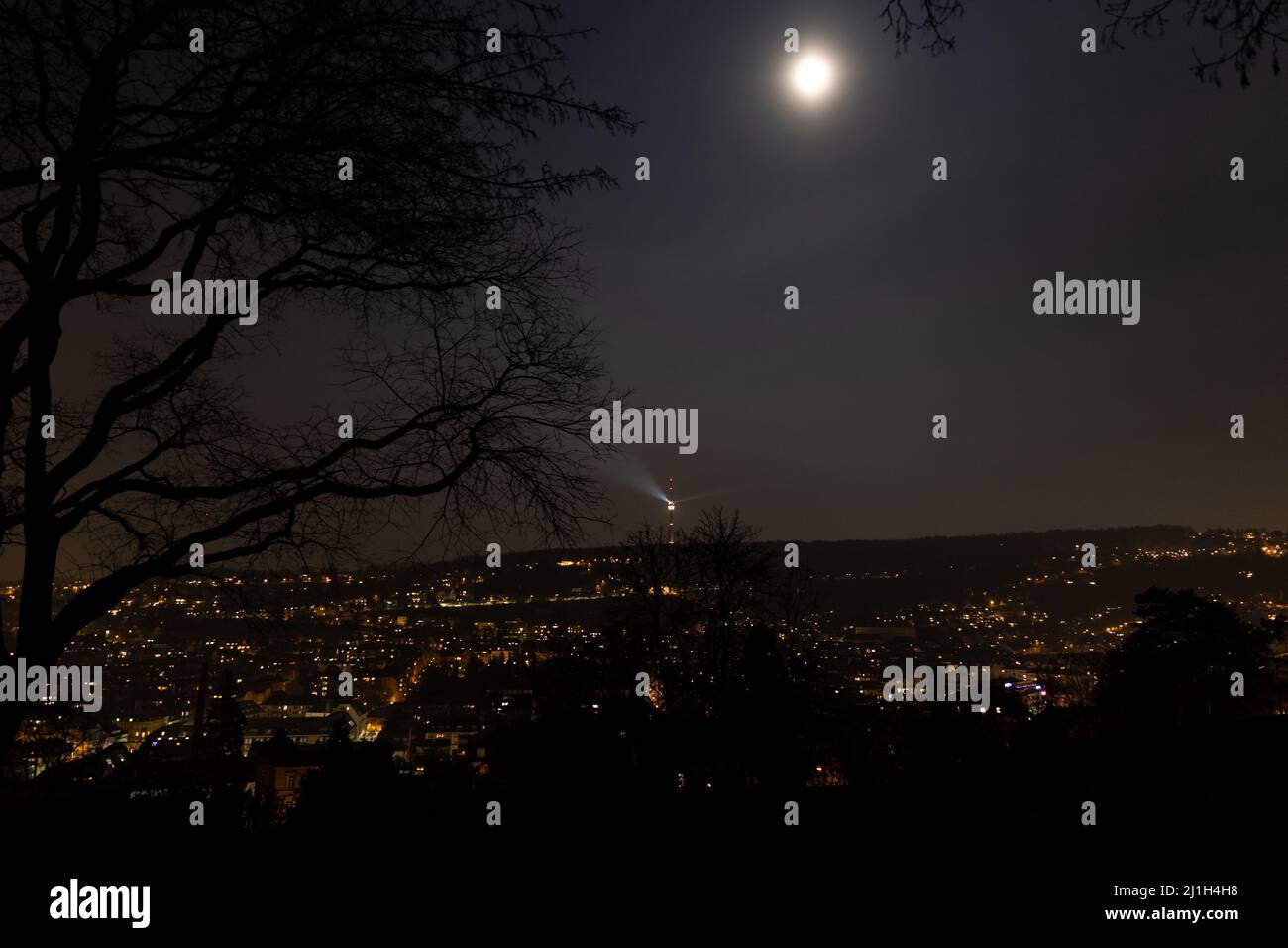 Night view of Stuttgart cityline. TV Tower with bright light beam, full ...