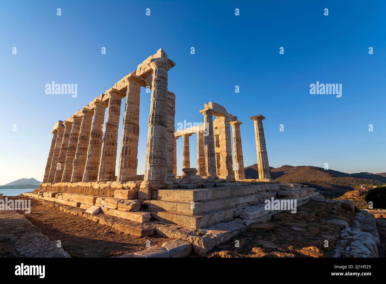 Ruins of an ancient temple of Poseidon at Greece Cape Sounio. Poseidon ...
