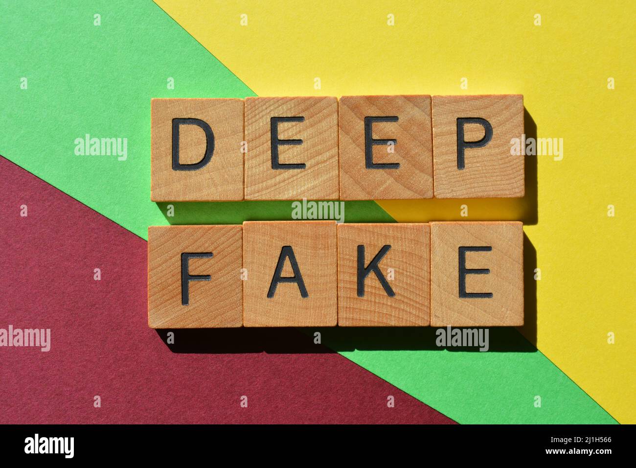 Deep Fake, words in wooden alphabet letters isolated on colourful ...