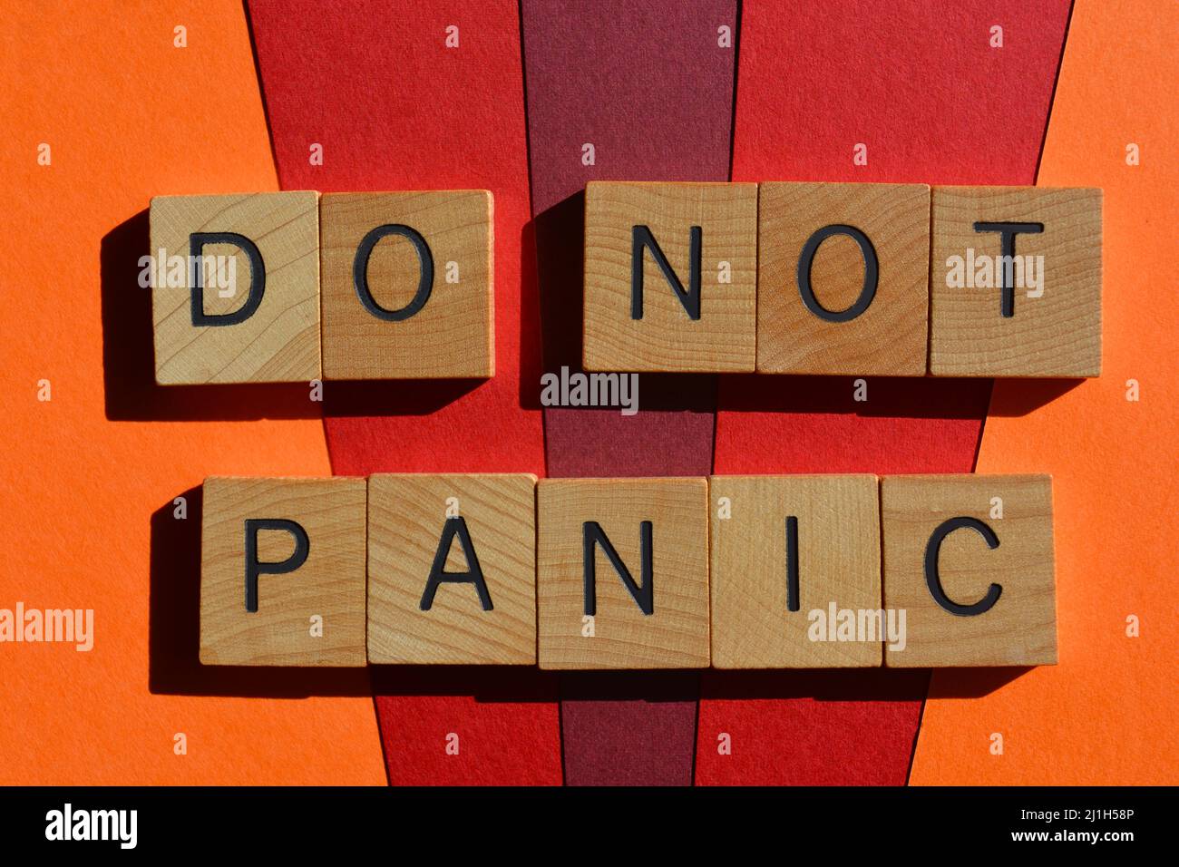 Do Not Panic, phrase in wooden alphabet letters isolated on red and ...