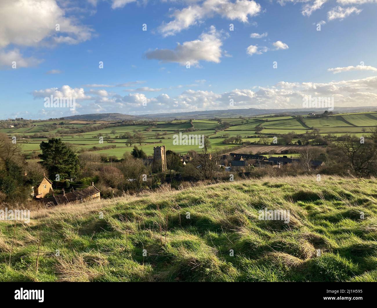 Spring landscape view over the village of East Chinnock to distant ...