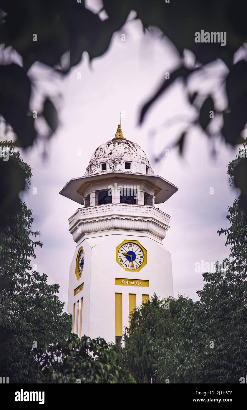 A framed view of the tower clock stopped at the time of the quake ...