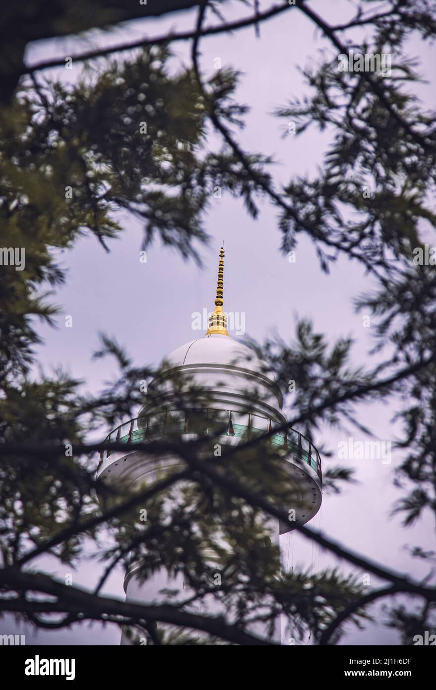 A view of a beacon through the tree twigs, the area of Shahid Gate ...