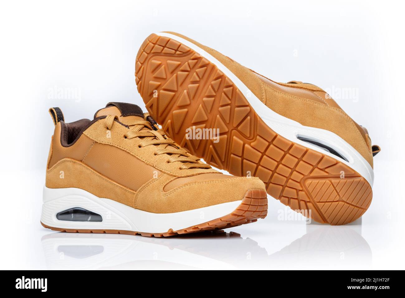 New yellow foxy leather and suede casual sport male sneakers on a white ...