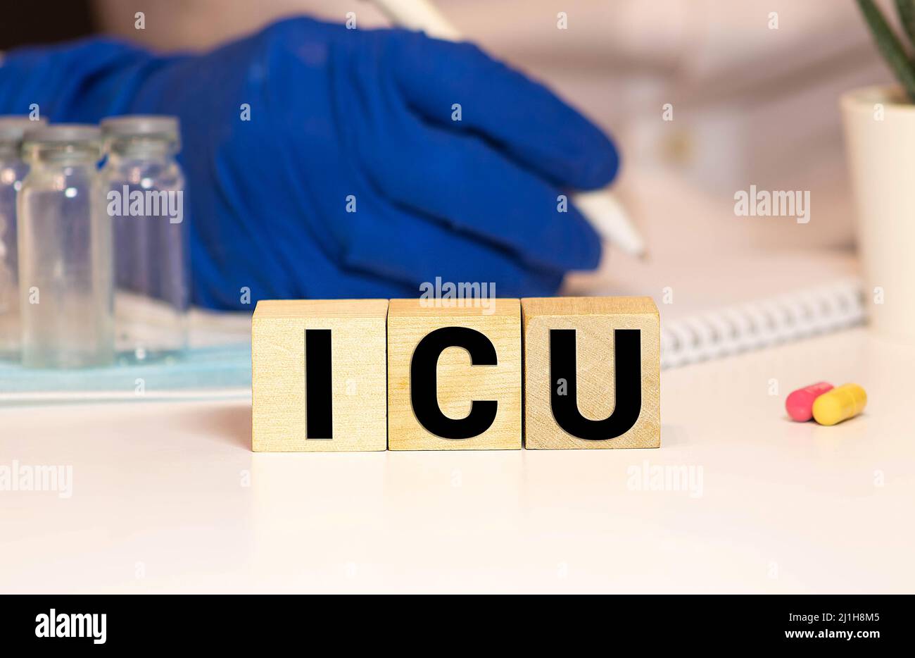 Medical stethoscope with wood block ICU on white background Stock Photo ...