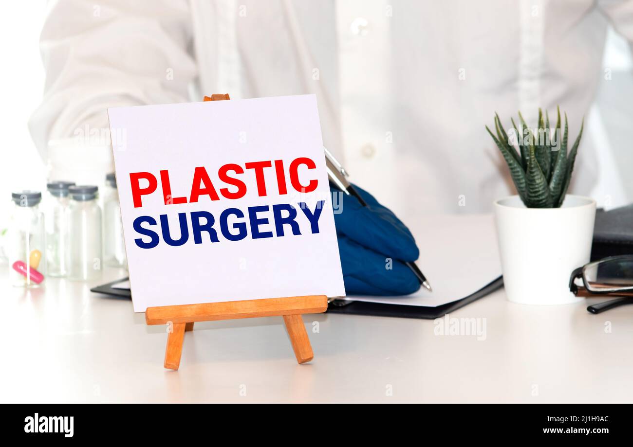Plastic Surgery Concept written on a card in doctors hands Stock Photo ...