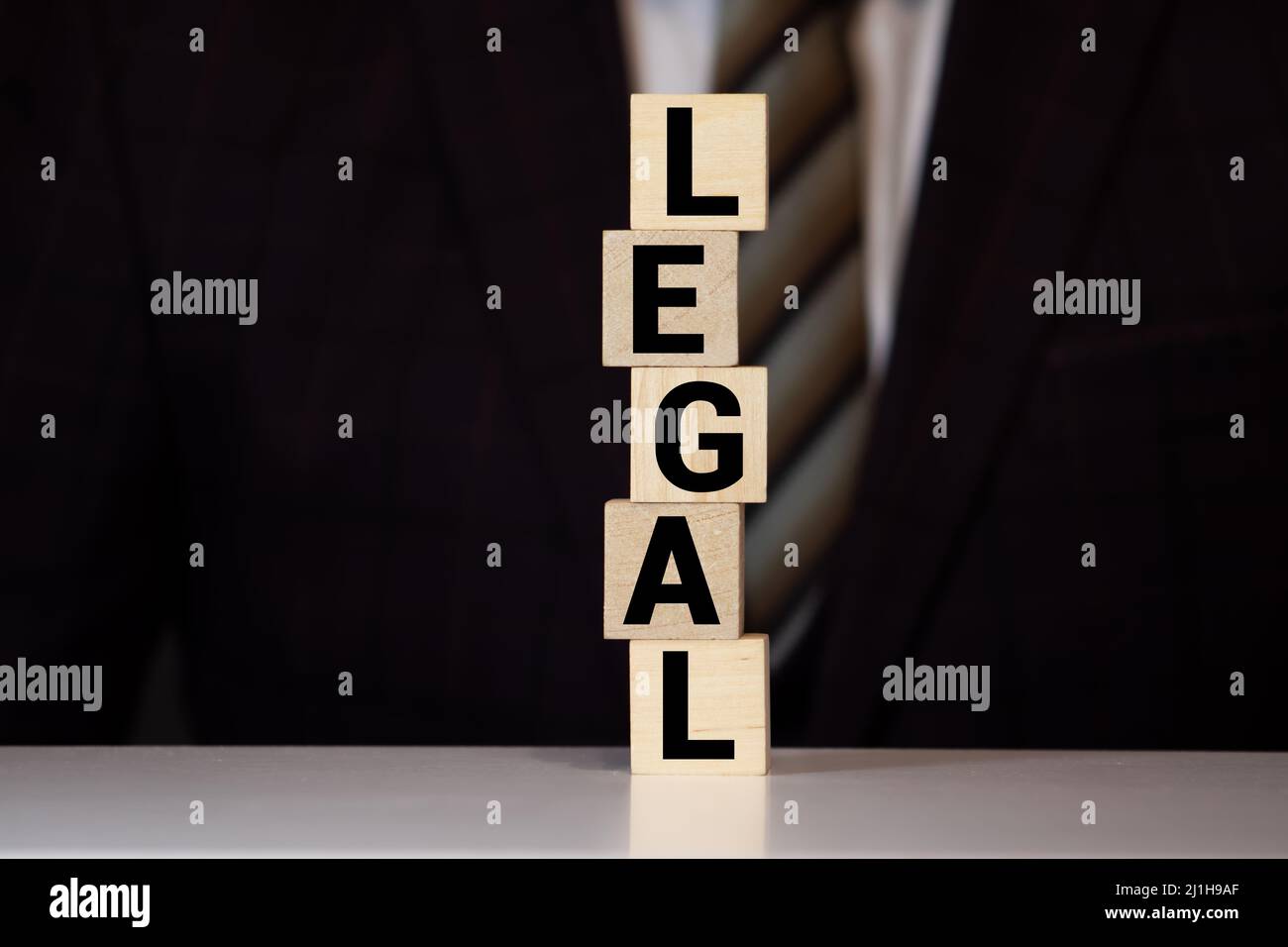 LEGAL word written on wood block, business concept Stock Photo - Alamy