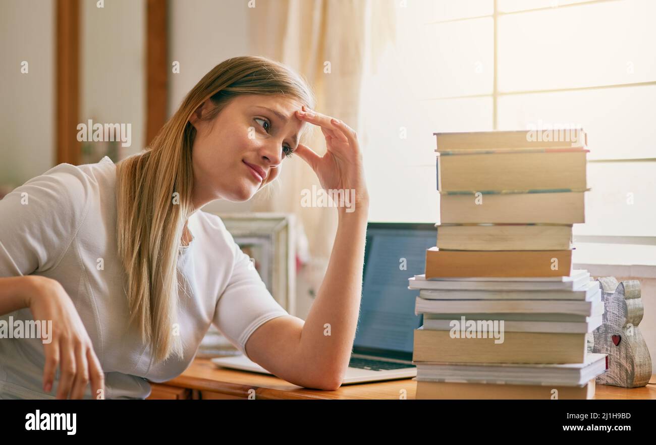 Overwhelmed woman with books hi-res stock photography and images - Alamy
