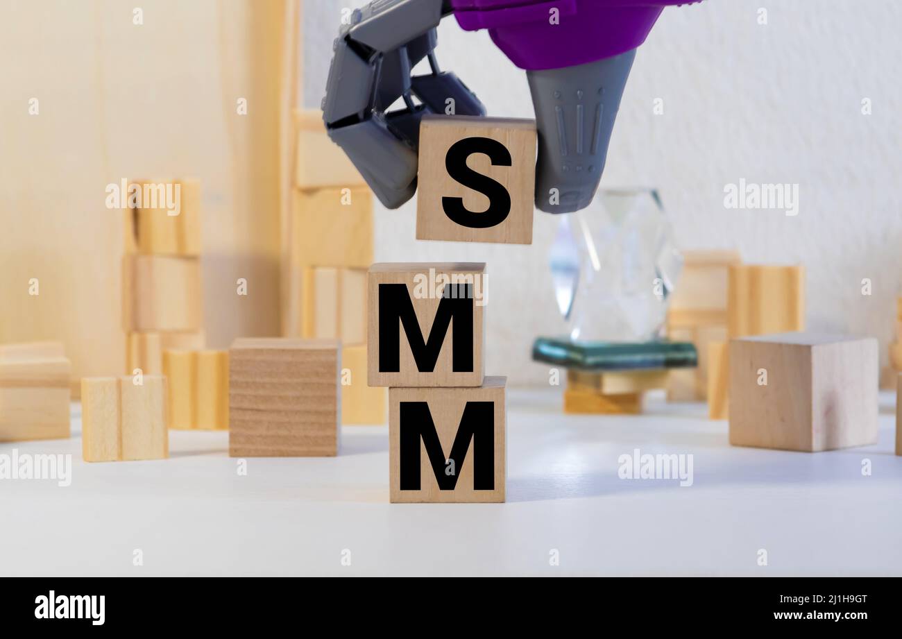 Wooden cubes with word SMM on blue table. Cubes with blue letters Stock ...
