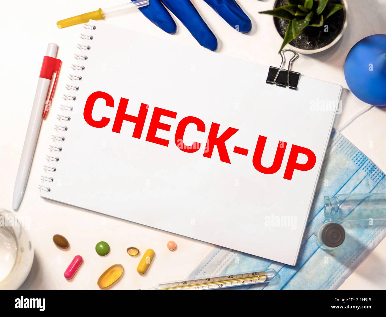 Annual Check-up text on paper with heart beat diagram, stethoscope ...