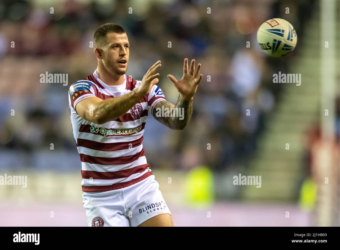 Cade Cust #6 of Wigan Warriors receives the ball Stock Photo - Alamy