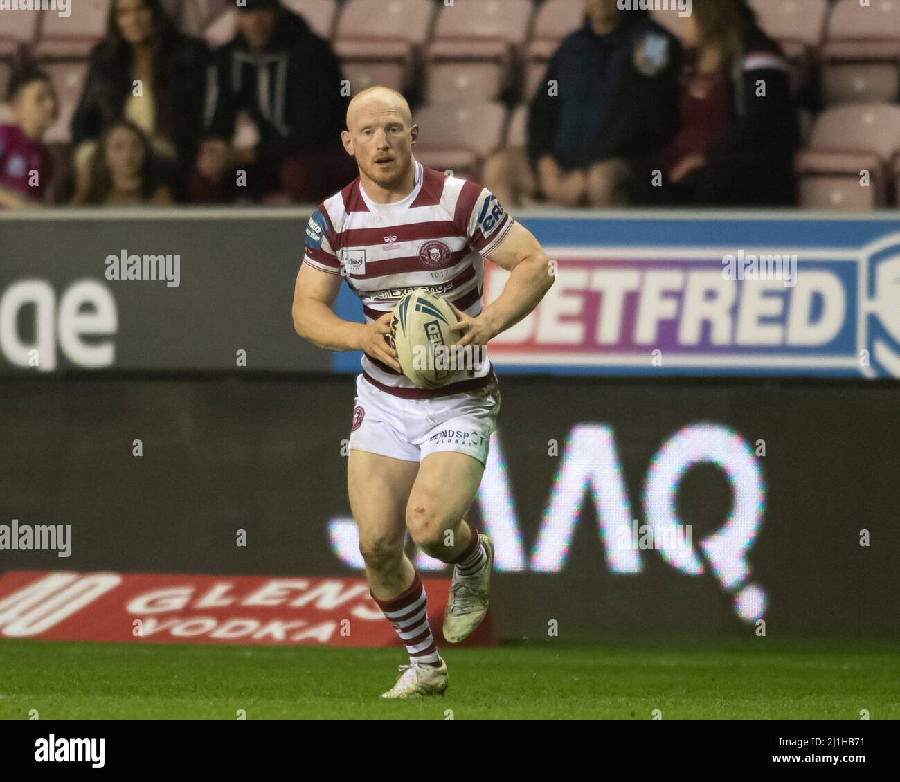 Liam Farrell #12 of Wigan Warriors runs with the ball Stock Photo - Alamy