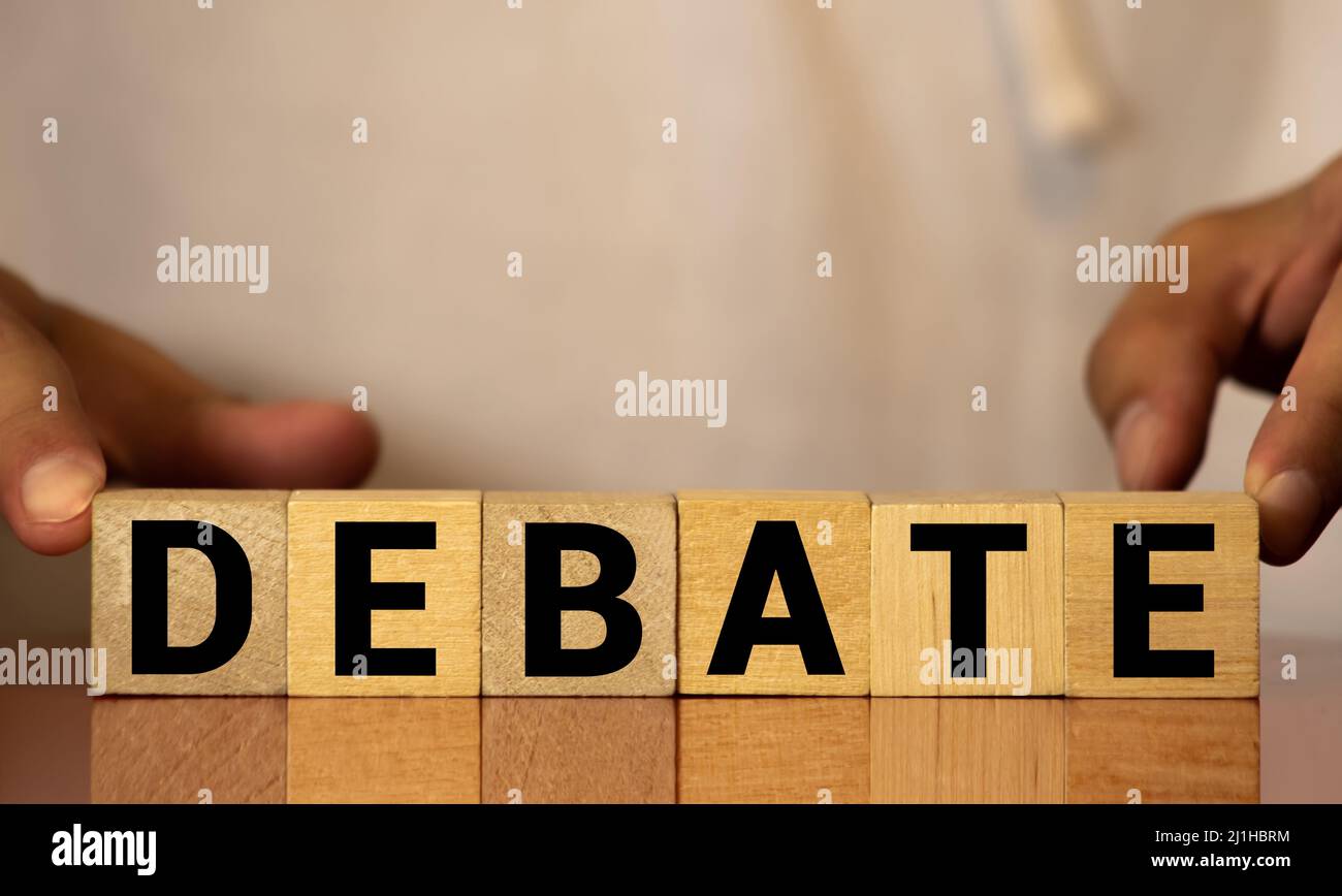 Wooden Blocks with the text: Debate, politic concept Stock Photo - Alamy
