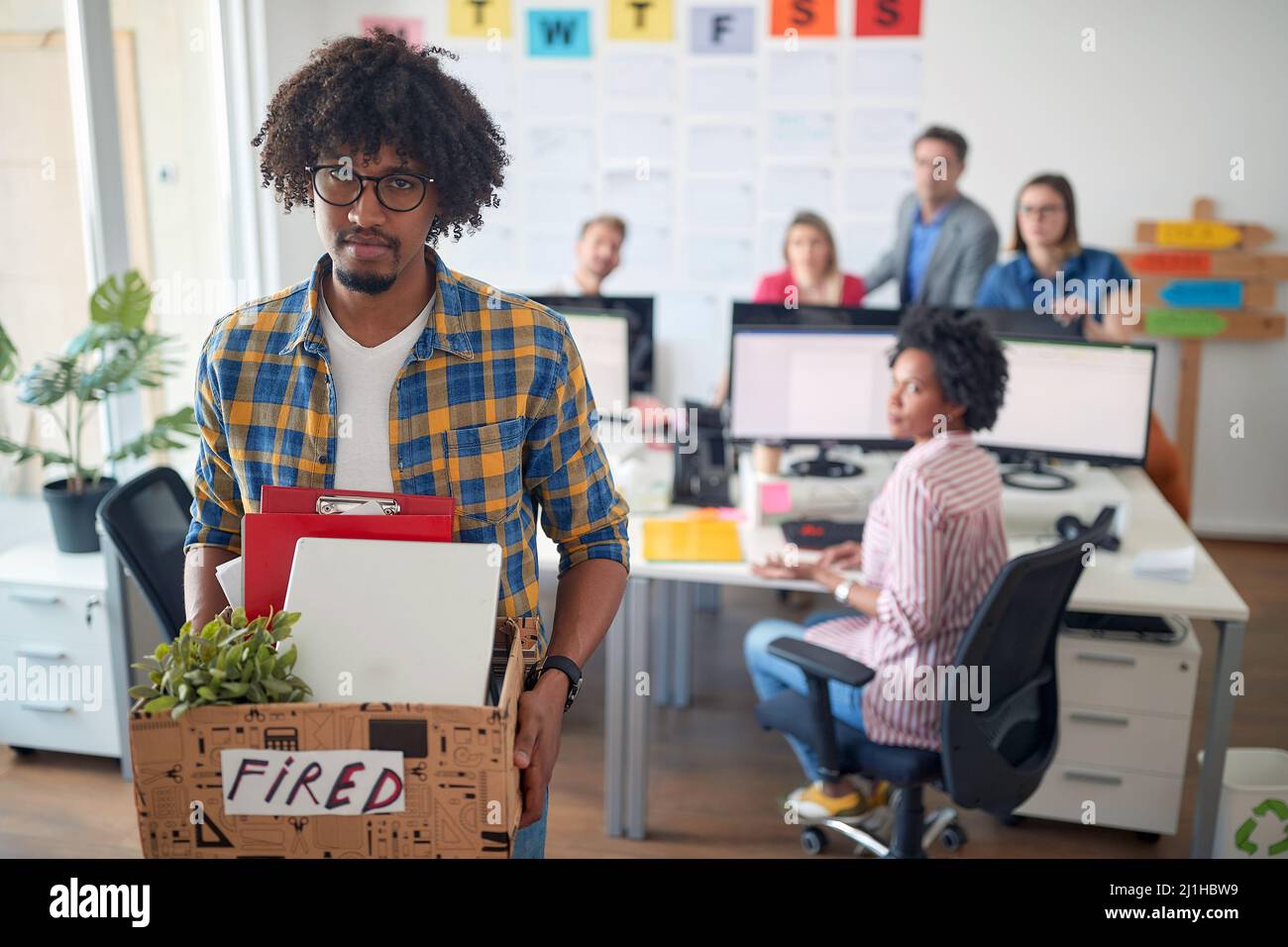 Young disappointed afro american getting fired from the office Stock ...