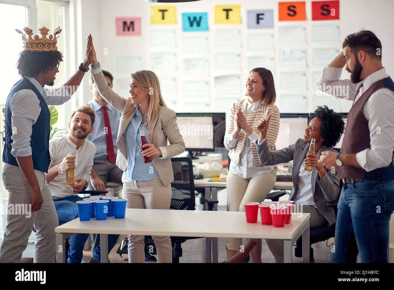 Group of creative casual corporate coworkers having fun in the office ...