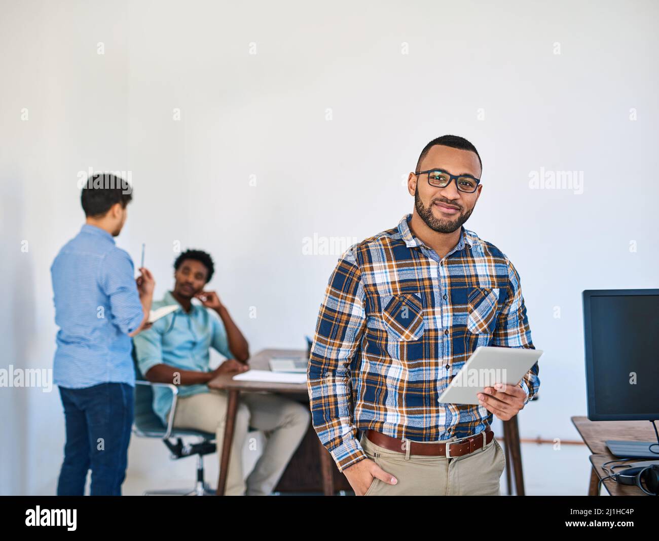 Smart technology makes management so much simpler. Portrait of a young ...