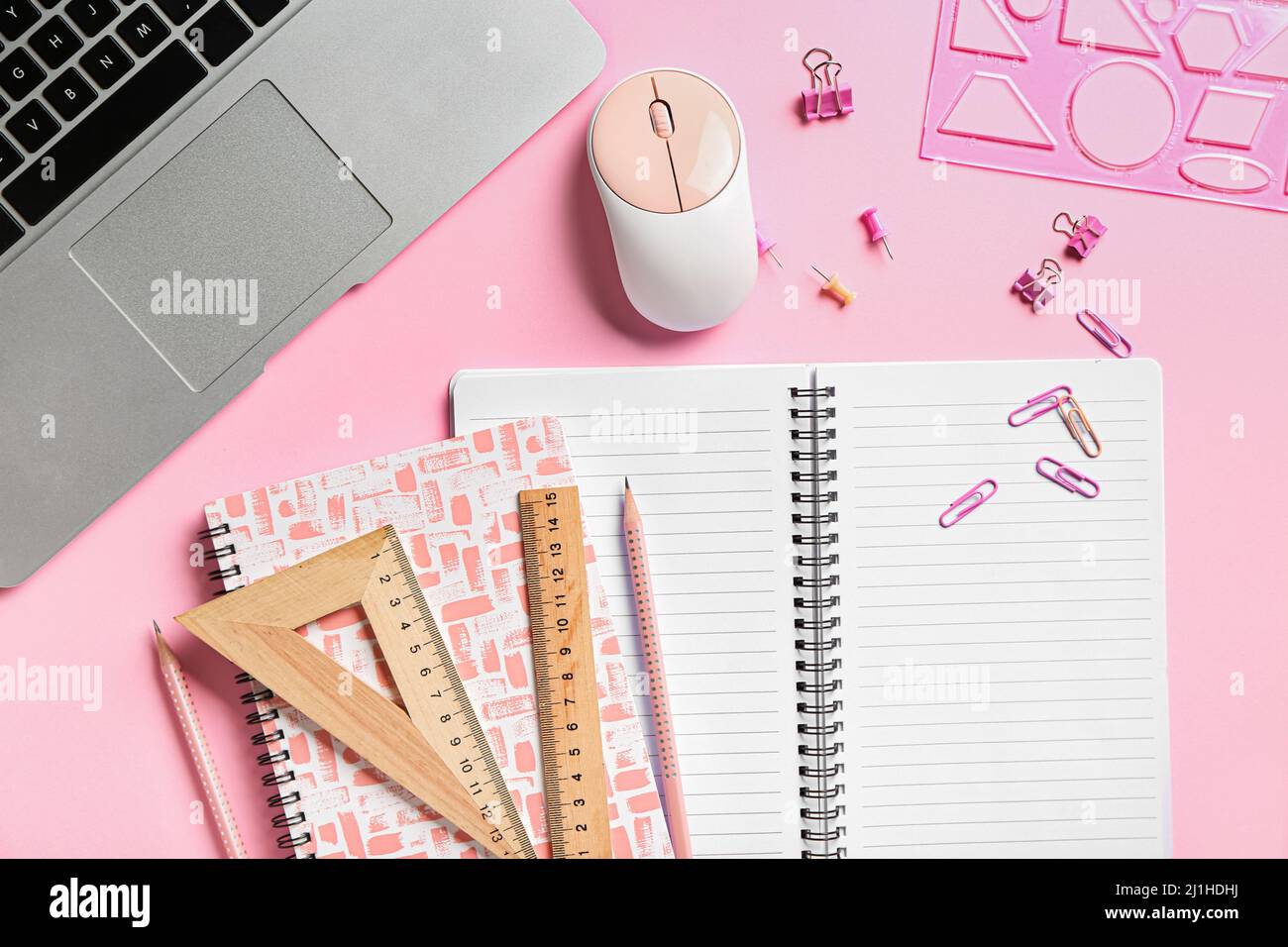 Blank notebook, laptop and stationery on pink background Stock Photo ...