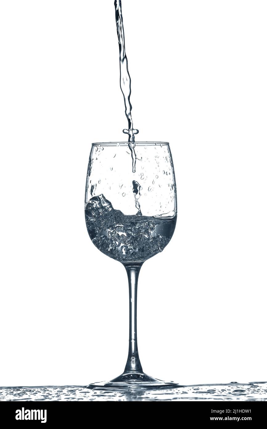 Glass of clean water with splash on white background Stock Photo - Alamy