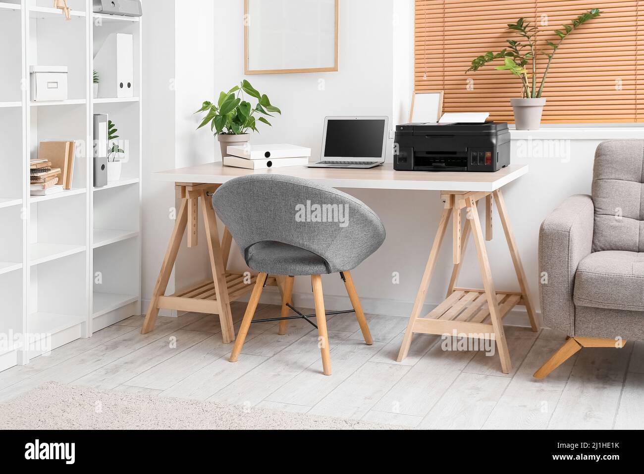 Workplace with modern laptop and printer in office interior Stock Photo ...