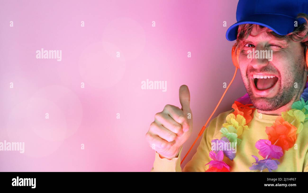 Happy man wearing yellow shirt and lei Hawaiian welcome necklace with ...