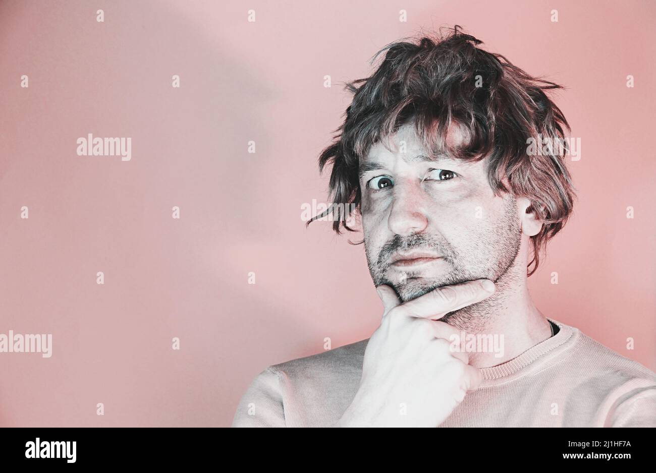 Portrait of confused handsome bearded young man standing scratching ...