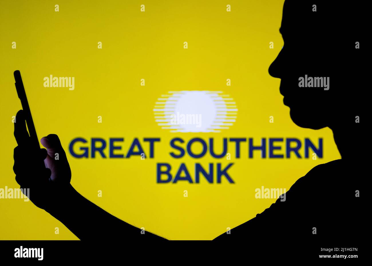 In this photo illustration, a woman's silhouette holds a smartphone ...