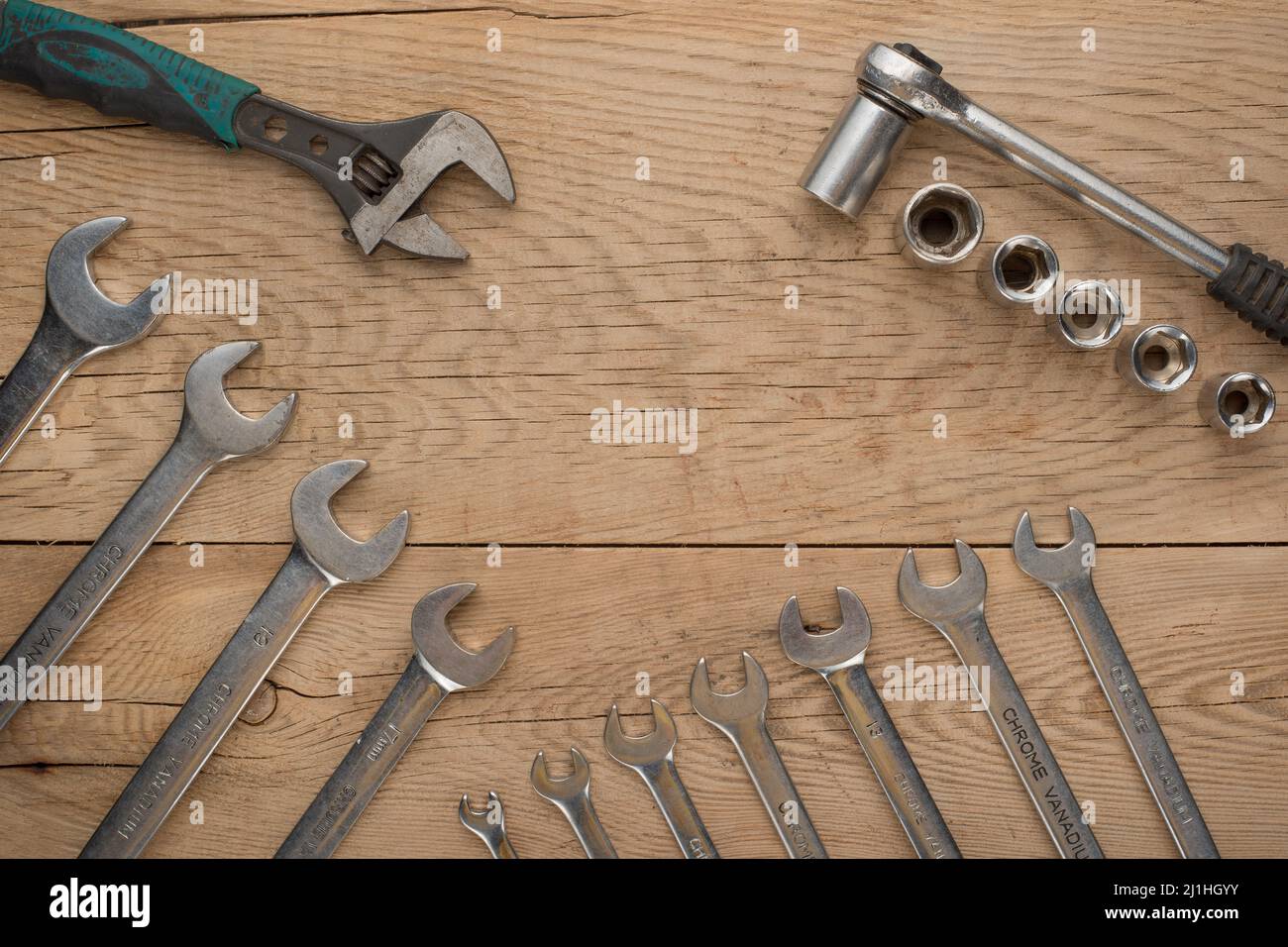 Working tools on a wooden rustic background. Top view with an empty ...