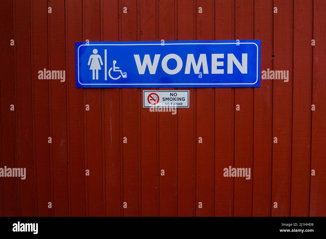 Vertical lines painted red boards in a pattern forming a texture with ...