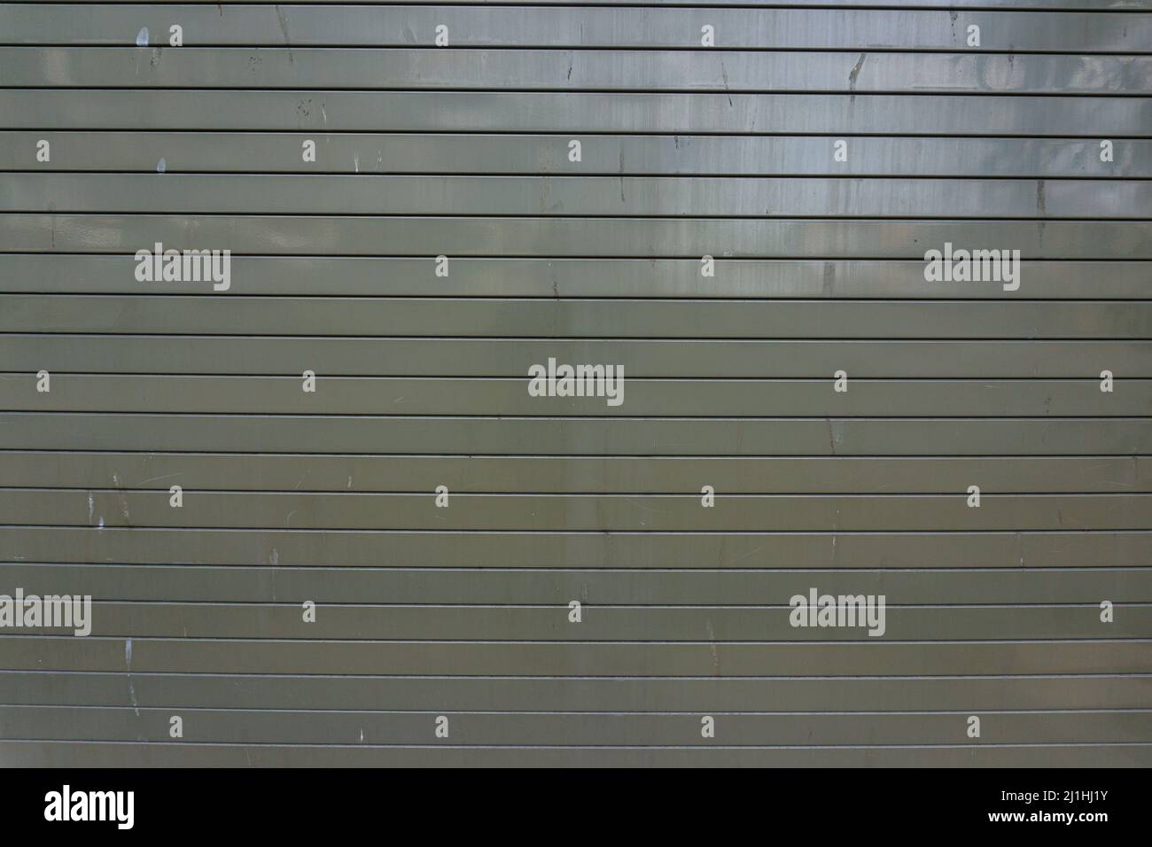 Shiny gray metal garage door texture with horizontal pattern on wall ...